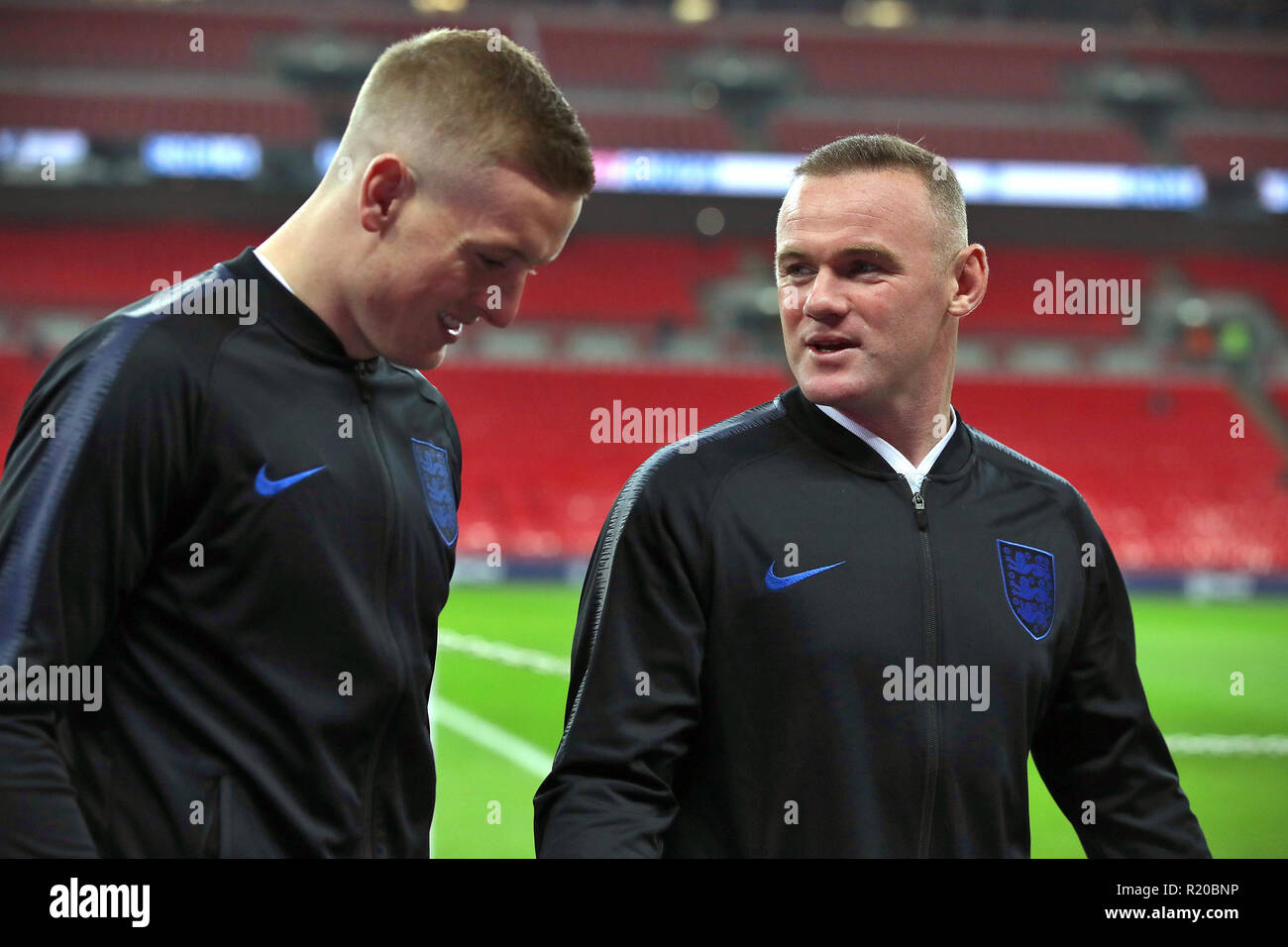 England's Wayne Rooney (right) speaks with Jordan Pickford before the ...