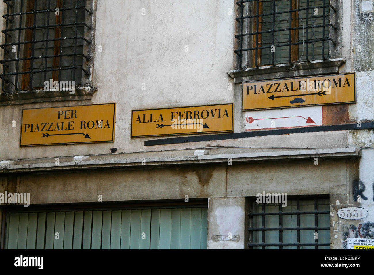 Venice, yellow metal road signs, for Piazzale Roma and the railway ...