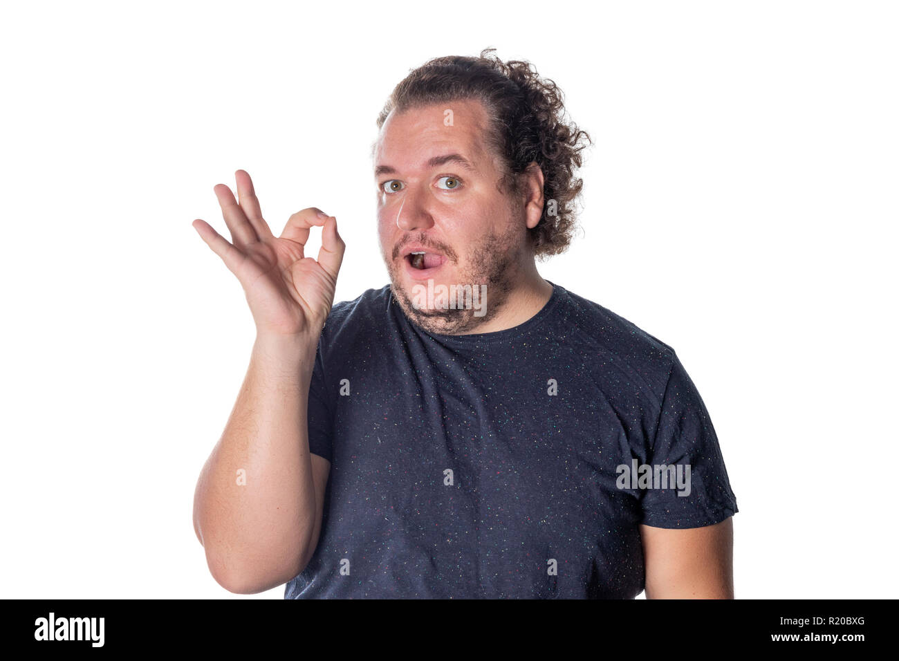 Fat funny man shows ok sign, demonstrates that everything is fine ...