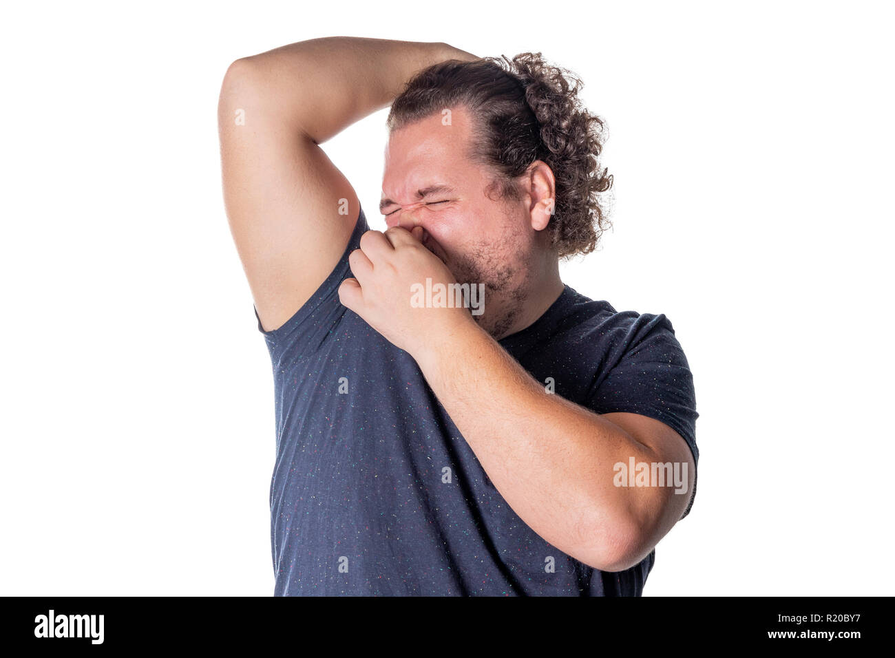 Fat man holds or pinches his nose shut because of a stinky smell or ...