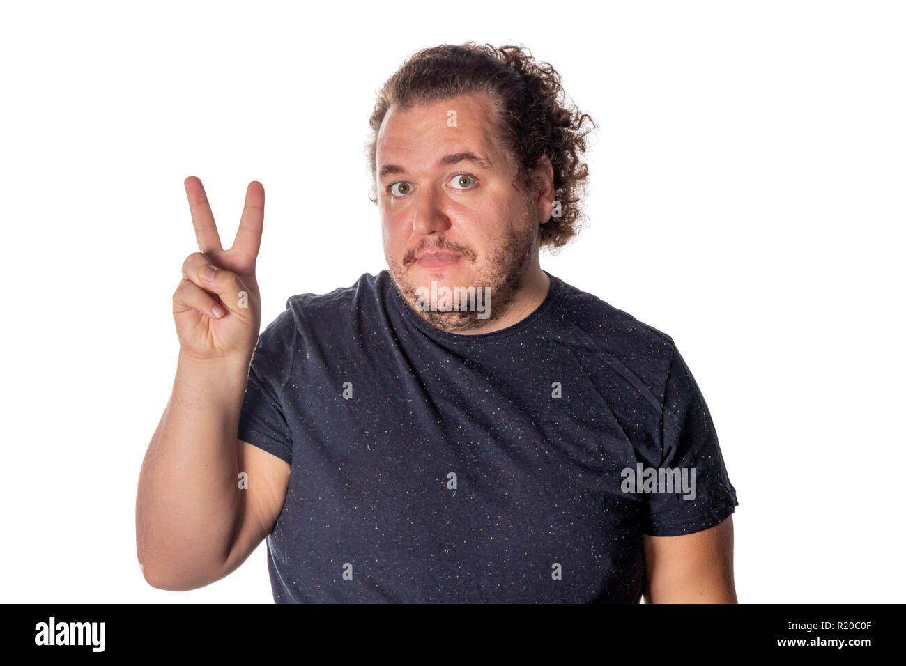 Portrait of funny fat man showing peace v-sign or victory gesture Stock ...