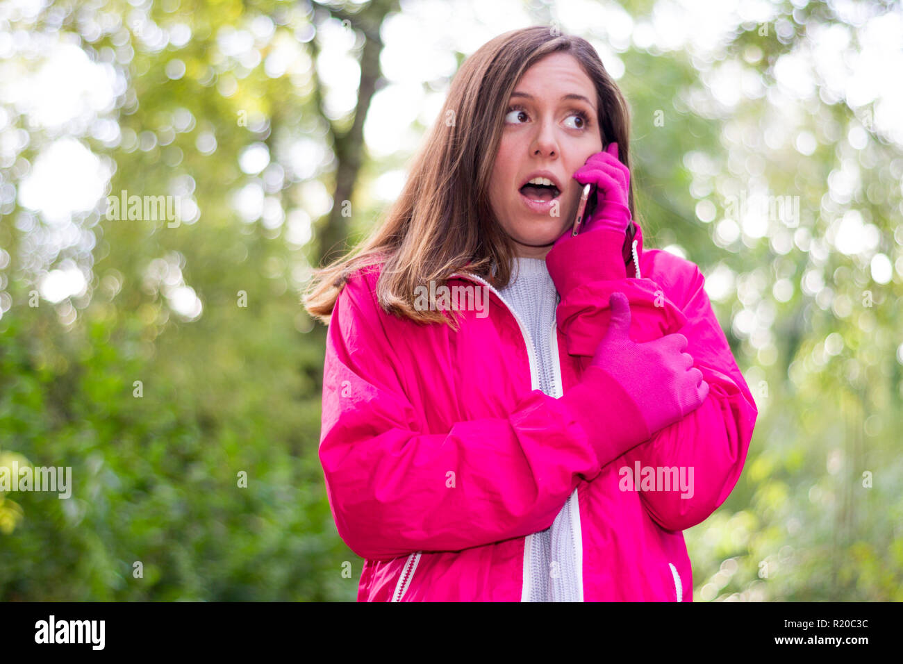 Young woman worried and cold calling by mobile phone in the helpless ...