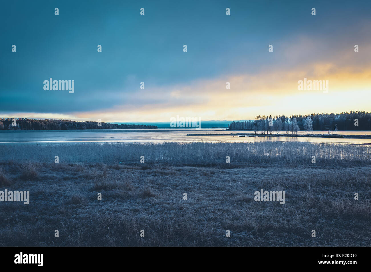Frozen lake at sunset. Photo from Kajaani, Finland Stock Photo - Alamy
