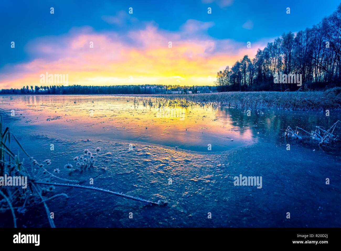 Frozen lake at sunset. Photo from Kajaani, Finland Stock Photo - Alamy