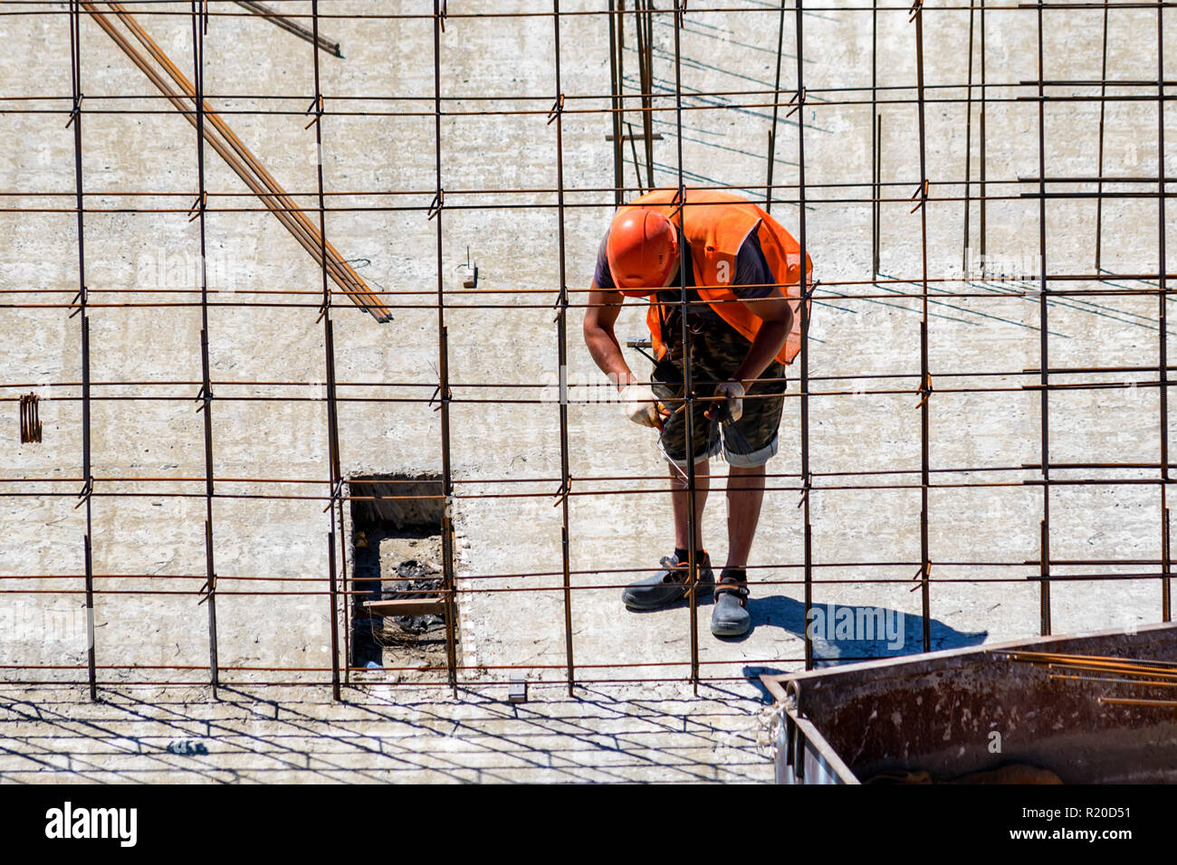 Construction worker in safety helmet at residential building ...