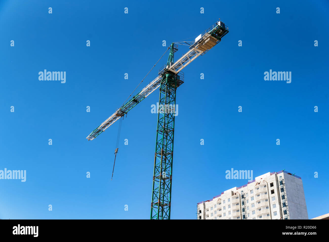 Modern construction site of building with crane Stock Photo - Alamy