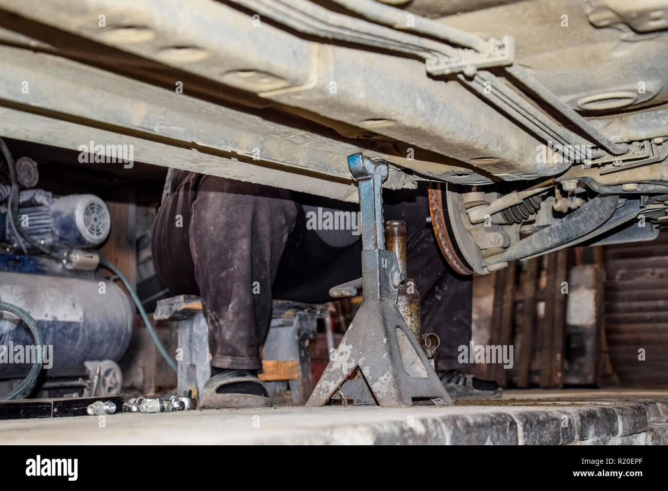Forged car for a hundred. Car repair. Car view from below Stock Photo ...