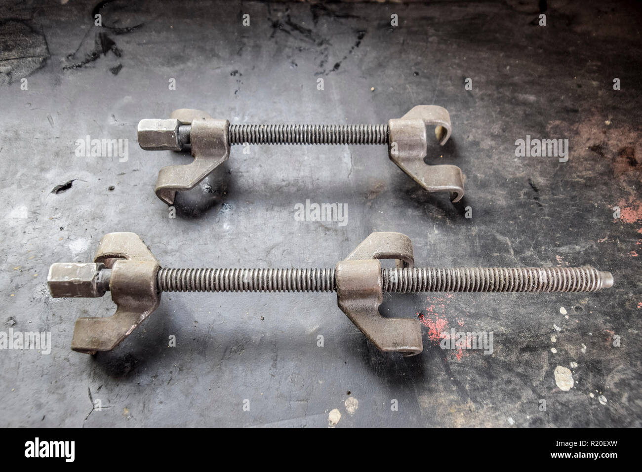 Screws for springs. A device for tightening springs Stock Photo - Alamy