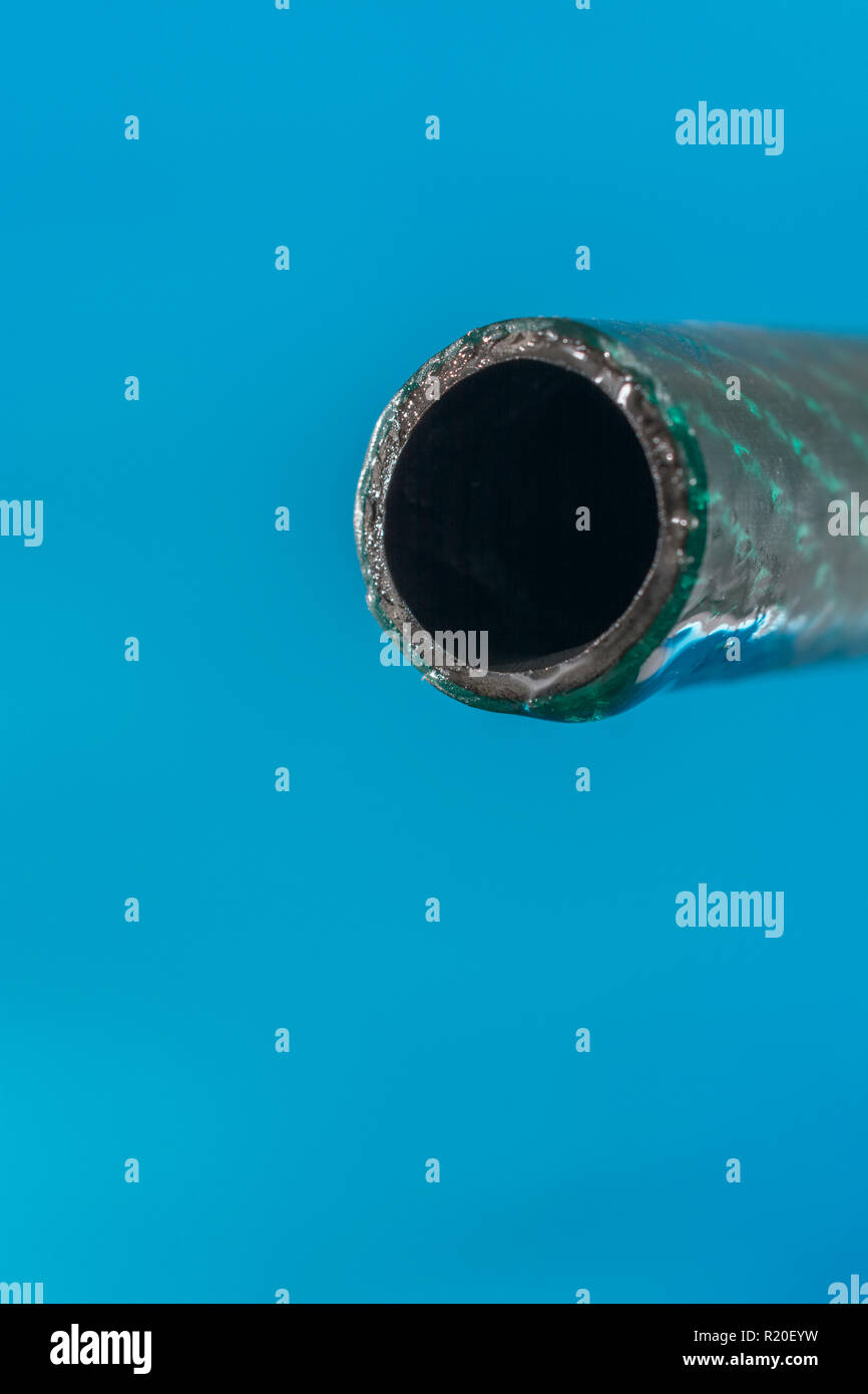 Plastic garden hosepipe / PVC hose pipe with last water drop against ...