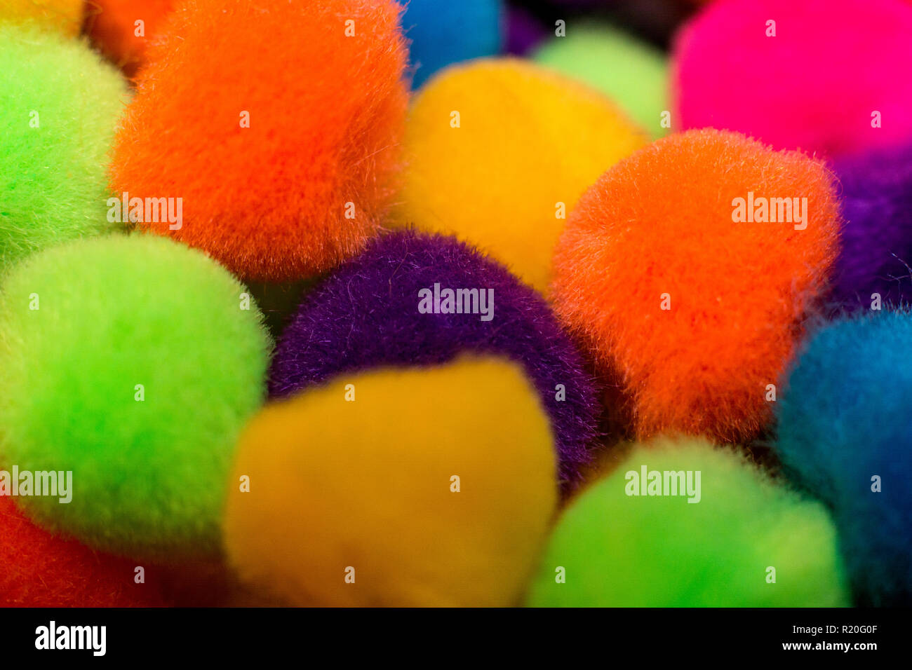 A macro cluster of colorful and soft pom-pom's piled up Stock Photo - Alamy