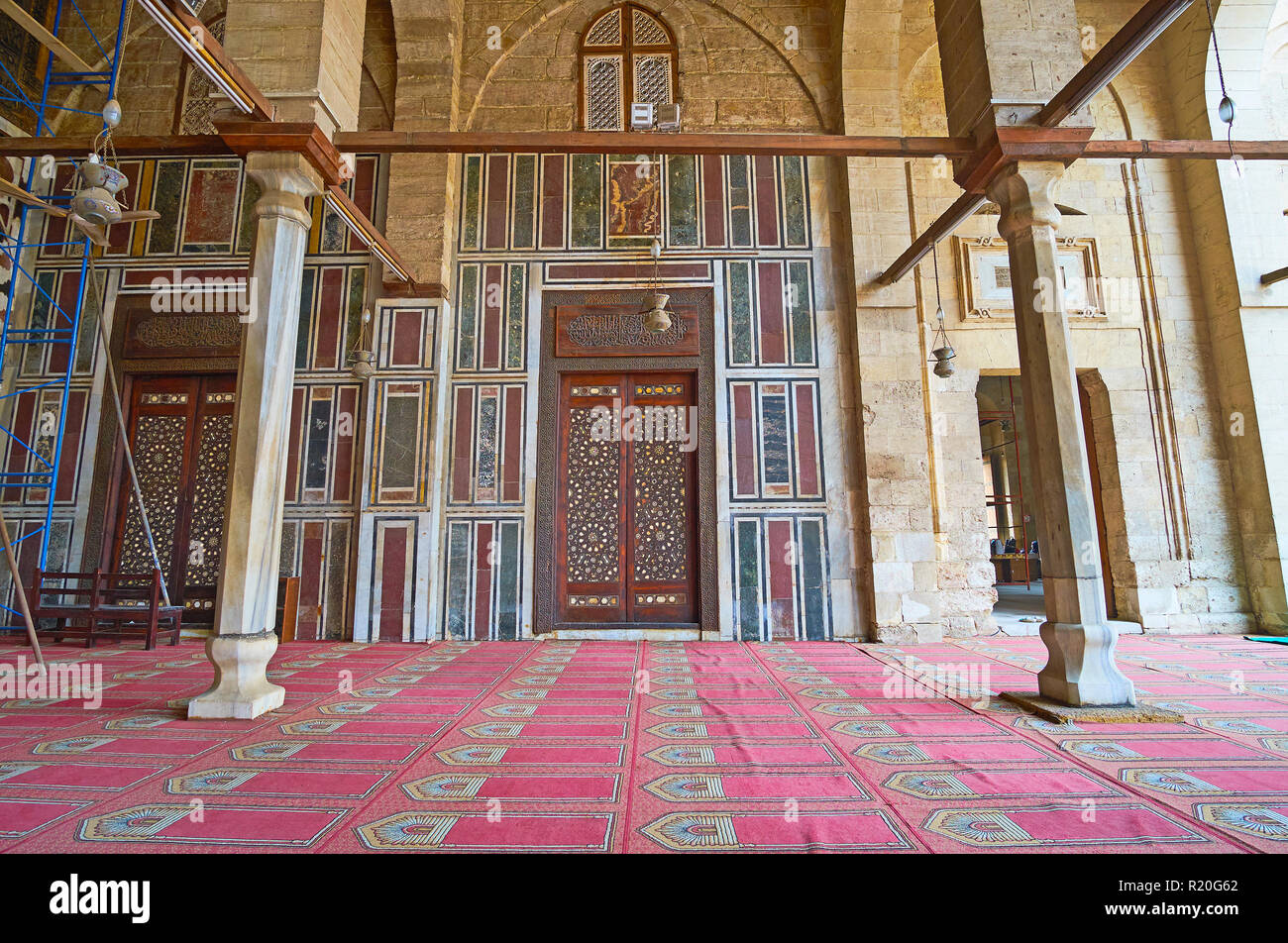 CAIRO, EGYPT - DECEMBER 21, 2017: The carved wooden door with ivory ...