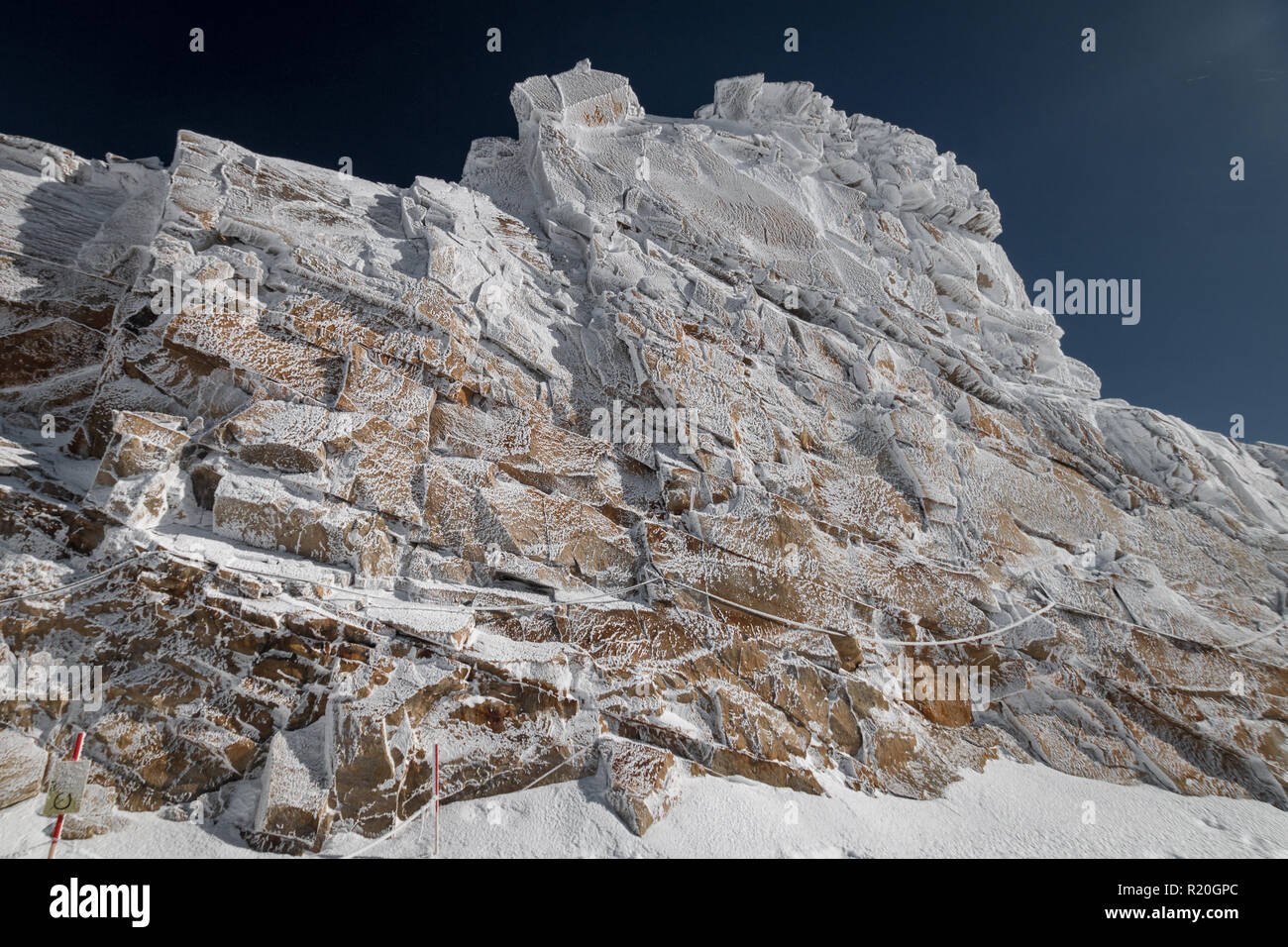 So called “frozen wall” in front of a blue sky in Austrian ski region ...