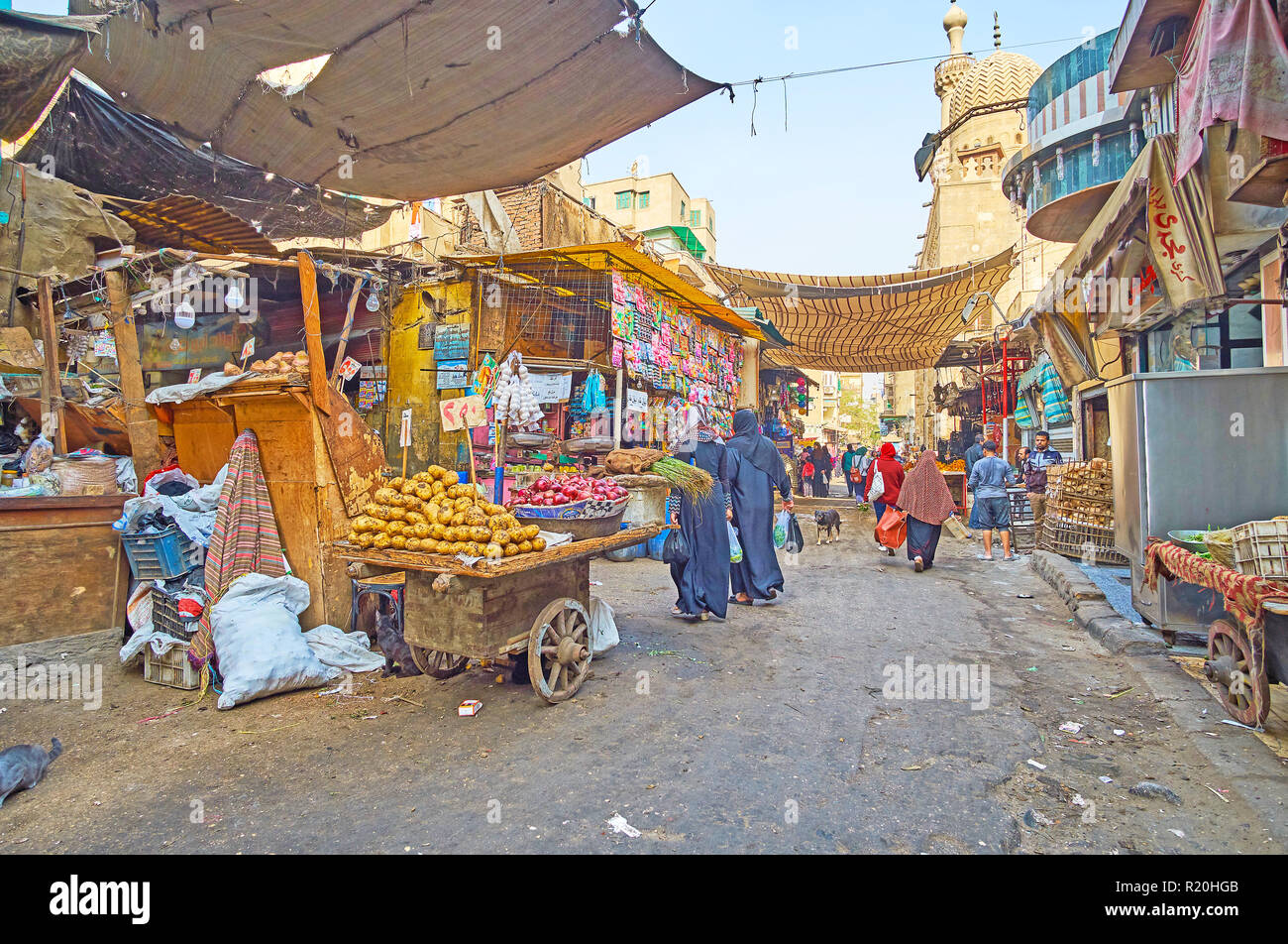 CAIRO, EGYPT - DECEMBER 21, 2017: The shabby food stalls and old wooden ...