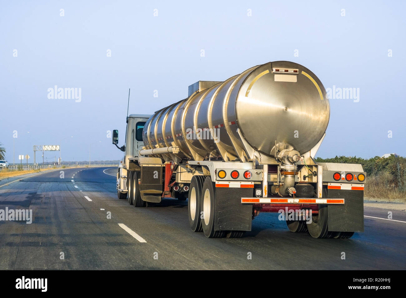 Tanker truck driving on the freeway Stock Photo - Alamy