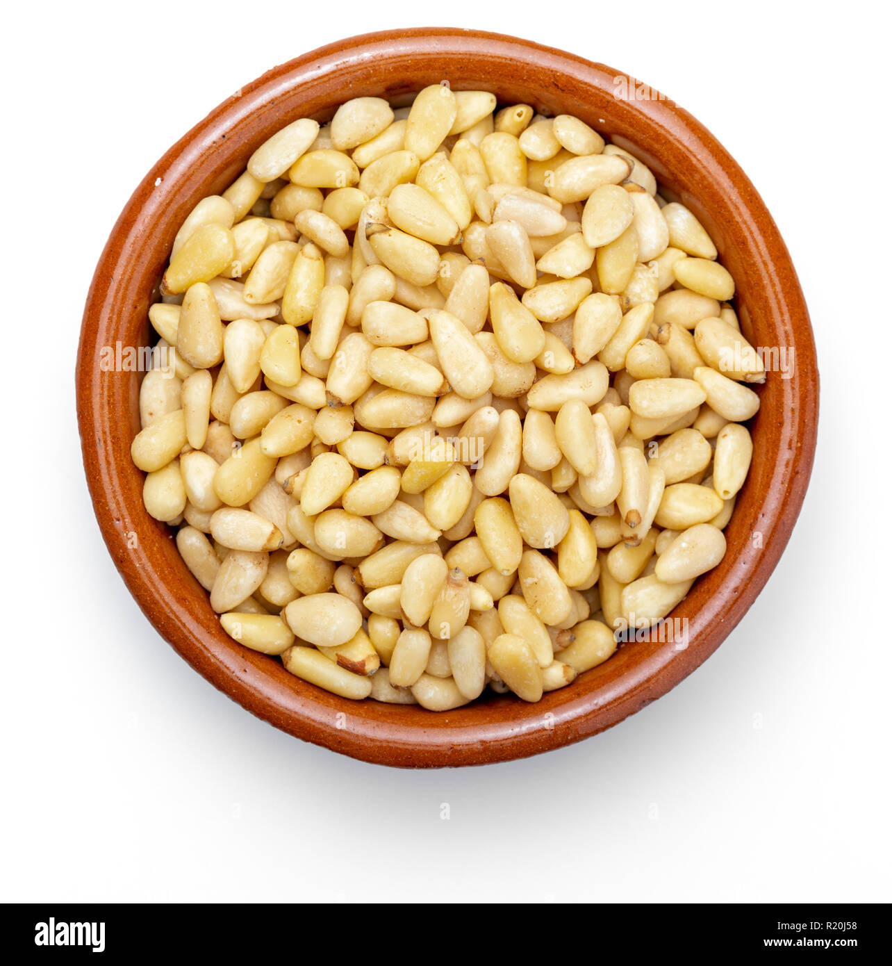 Peeled pine nuts. In clay container. Aerial view (from above, top view ...