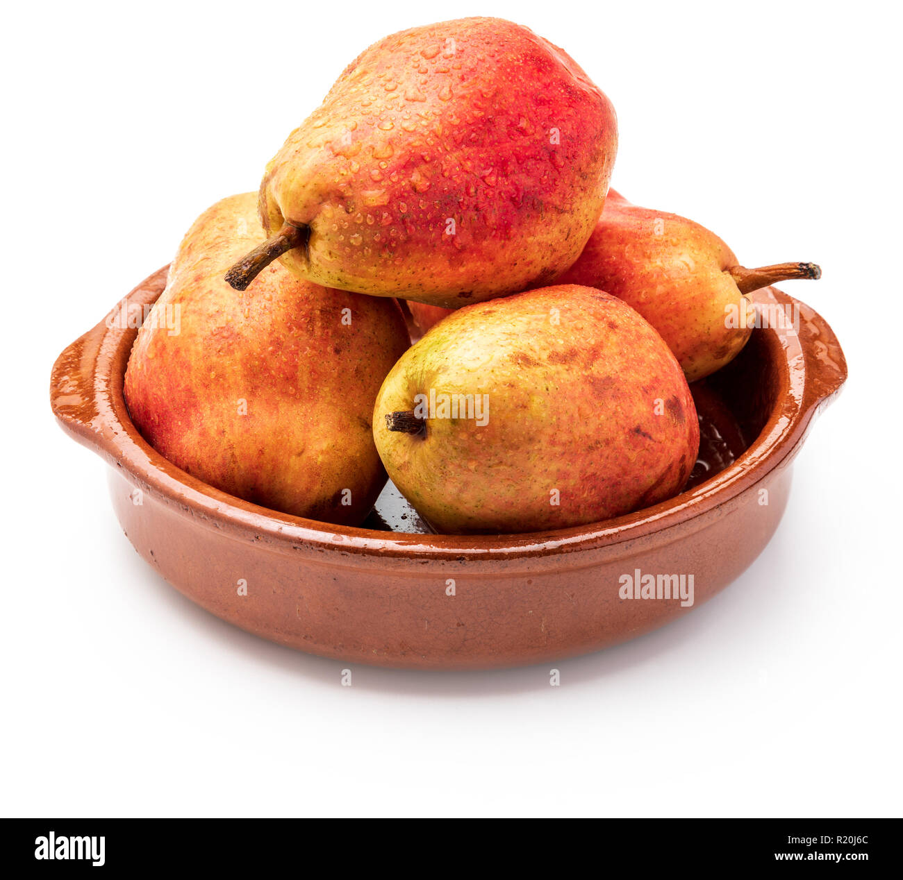 Delicious red pears in clay pot. Isolated on white background Stock ...