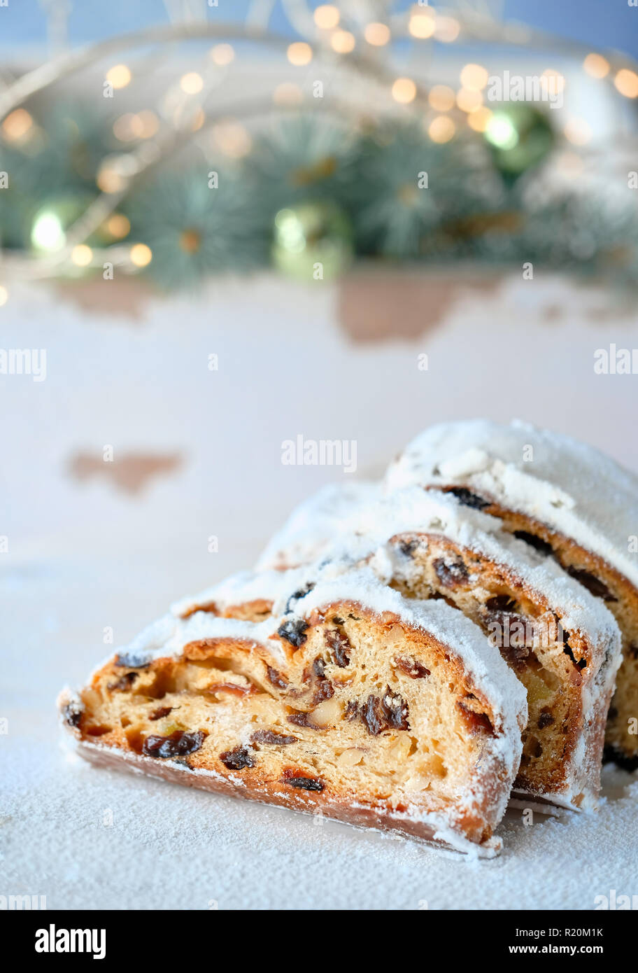 Christmas stollen on white festive background with fir twigs and ...