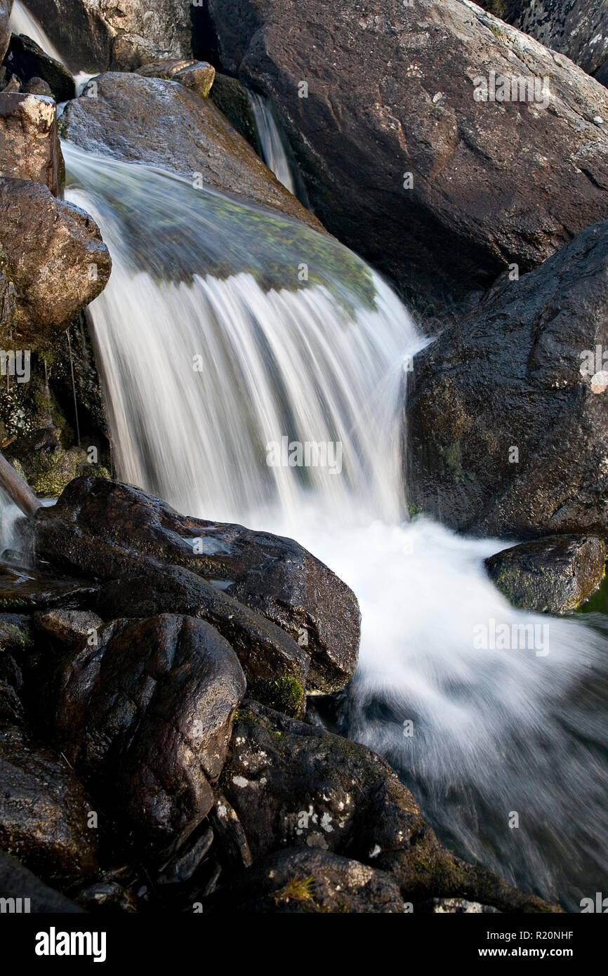 Small waterfall in a rocky stream in Snowdonia, North Wales Stock Photo ...