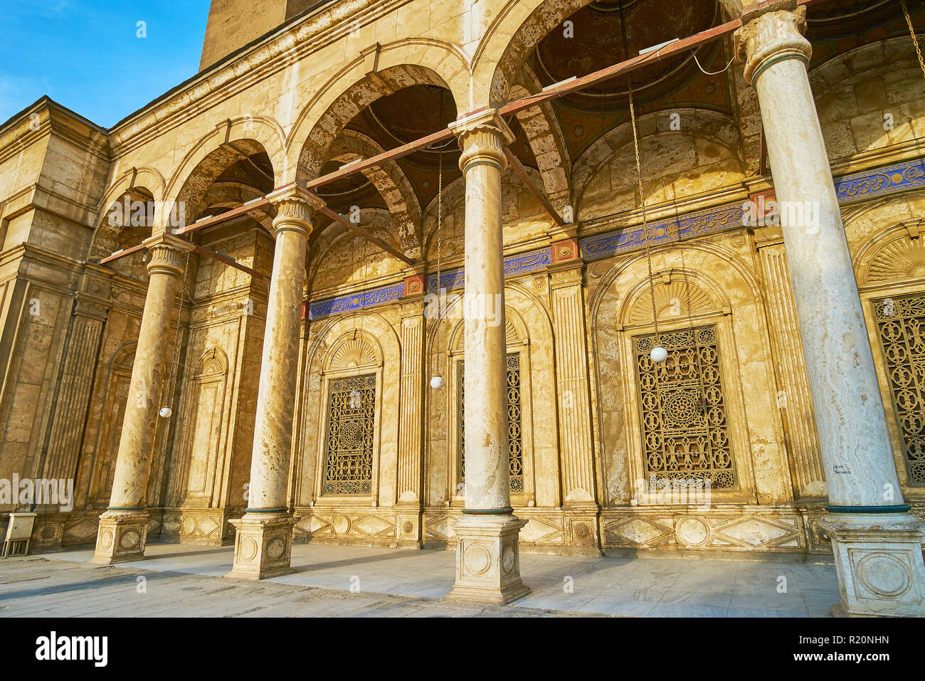 The arcade of Alabaster mosque with slender columns and carved walls ...