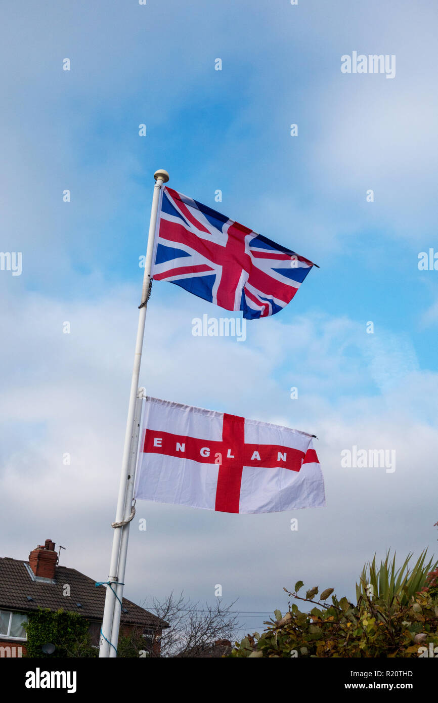 The saint georges flag with the union jack flying hi-res stock ...