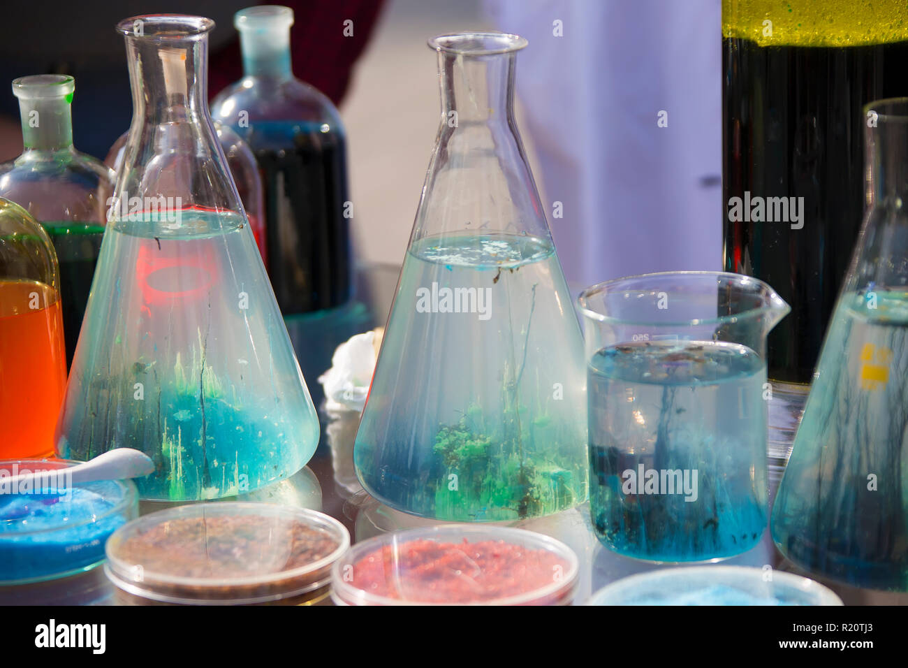 Glass flasks with colored powder Stock Photo - Alamy