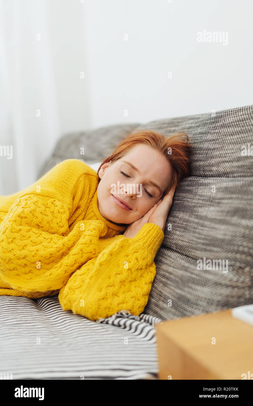 Woman taking a nap sofa hi-res stock photography and images - Alamy