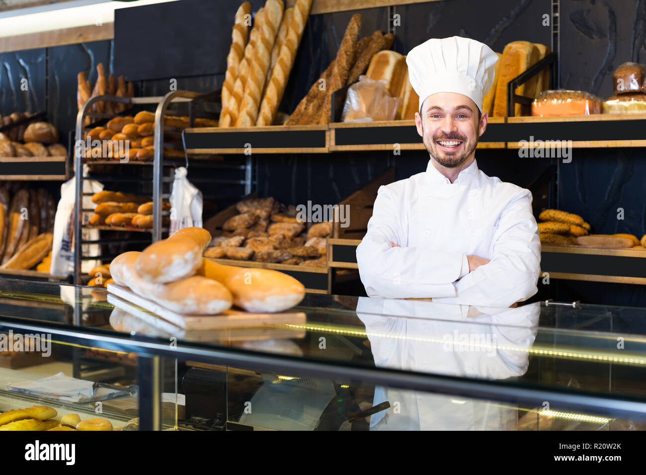 Baker with pleasure demonstrate their baked goods at the bakery Stock ...