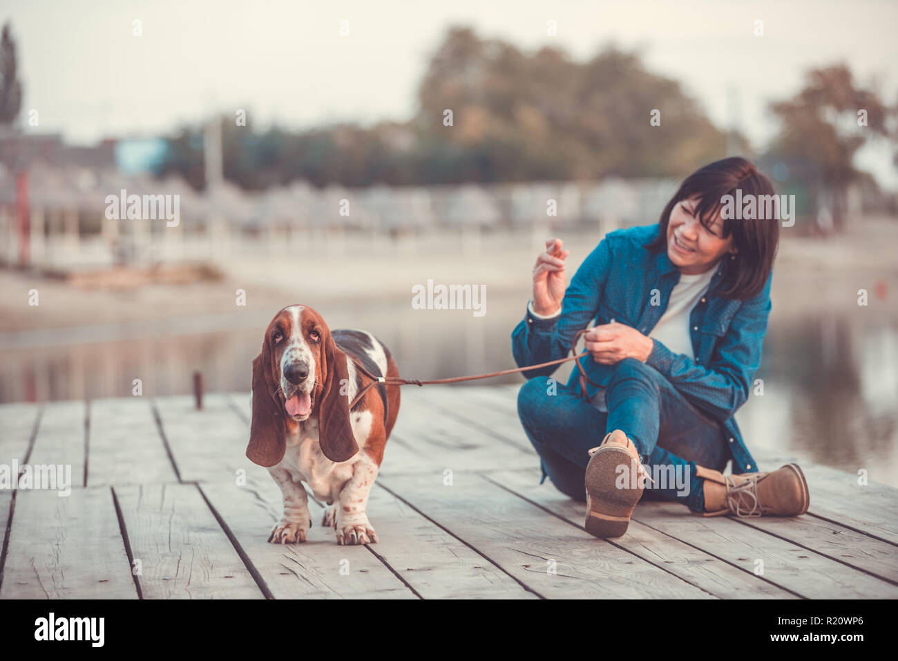 People Hugging Basset Hound