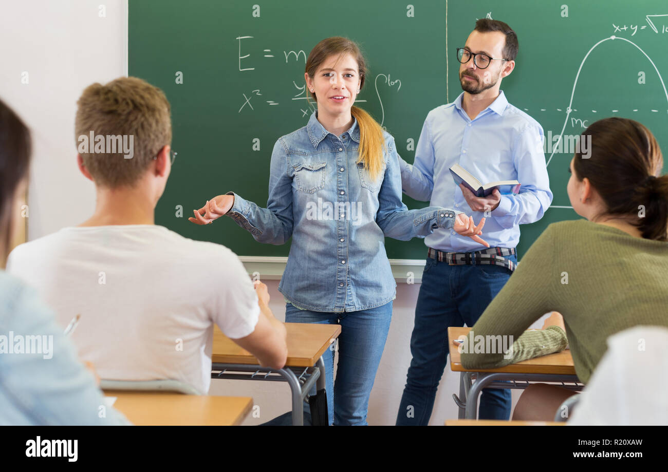 Young girl is learning and answering the question near blackboard in ...