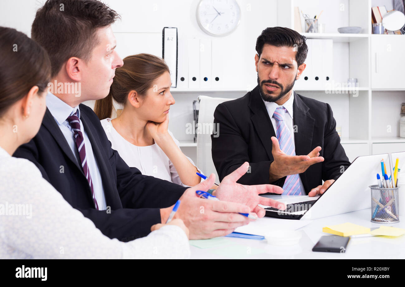 Outraged manager expressing dissatisfaction with teamwork of colleagues ...