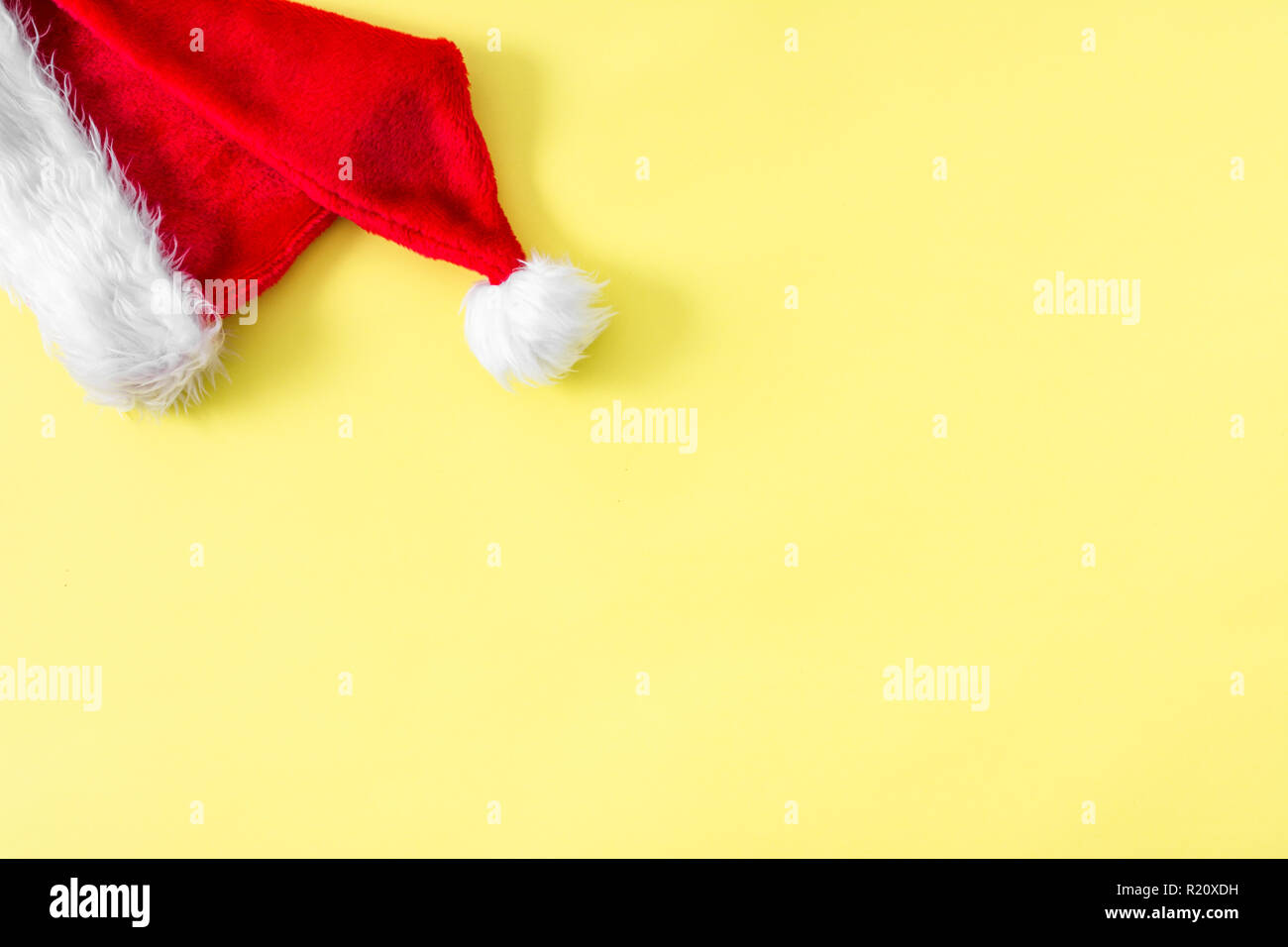 Santa claus hat. Christmas pastel yellow background. Christmas banner ...