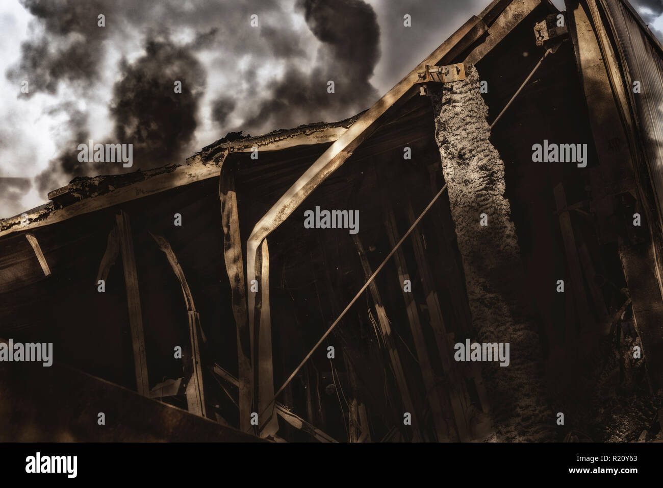 Damaged industry supermarket after arson fire with burn debris of ...