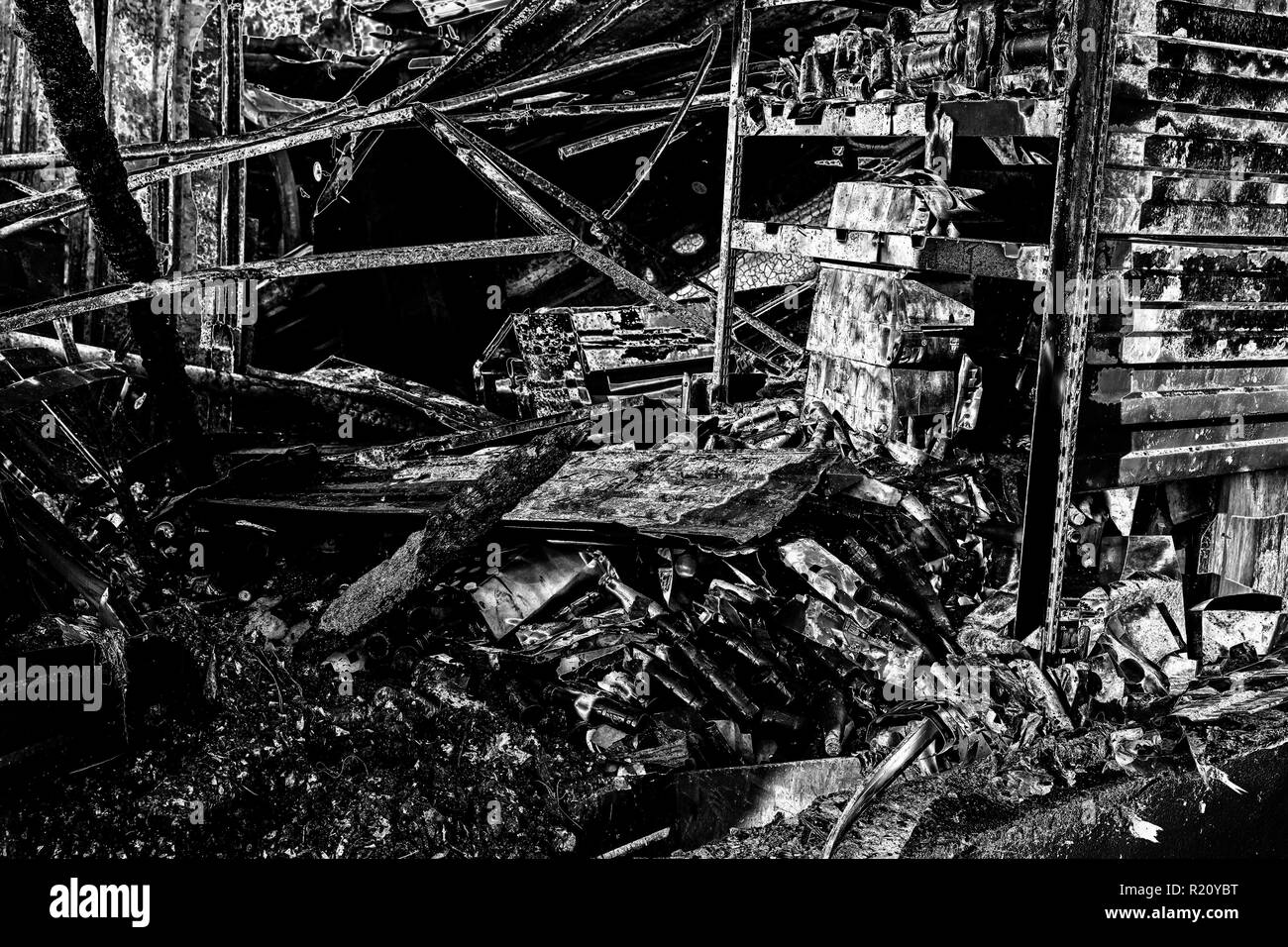 Damaged industry supermarket after arson fire with burn debris of ...