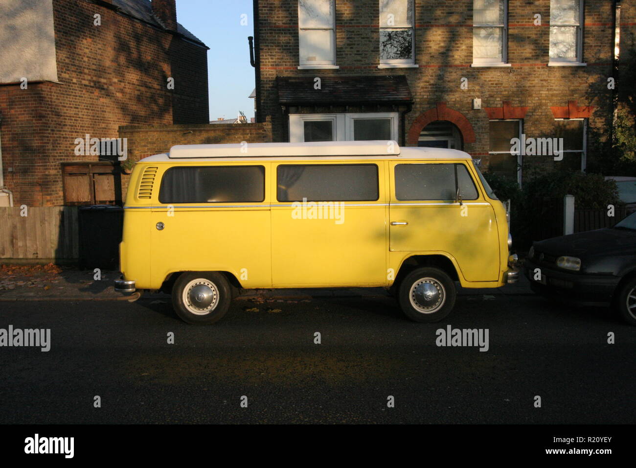 Yellow VW camper van Stock Photo - Alamy