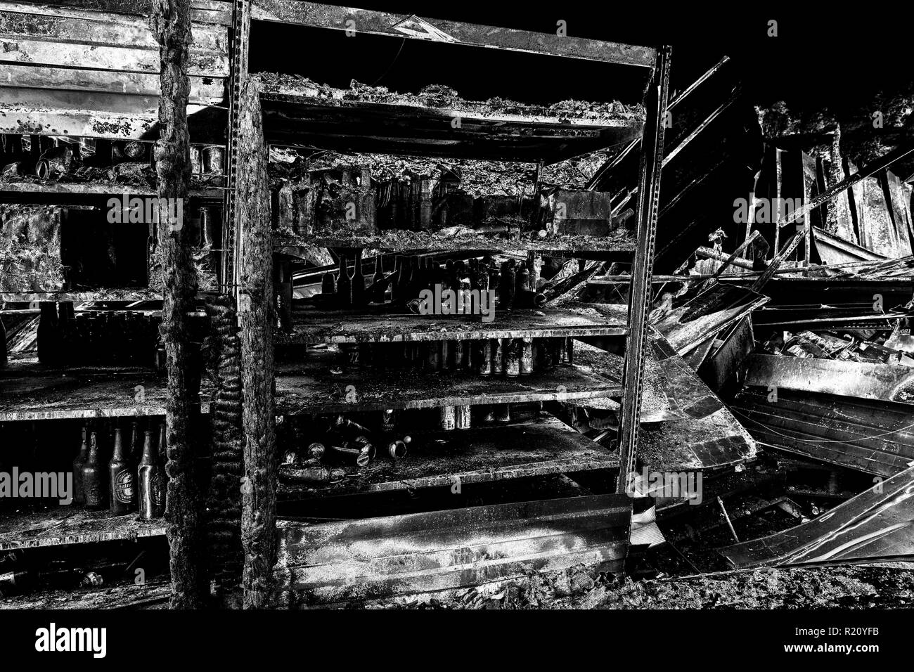 Damaged industry supermarket after arson fire with burn debris of ...