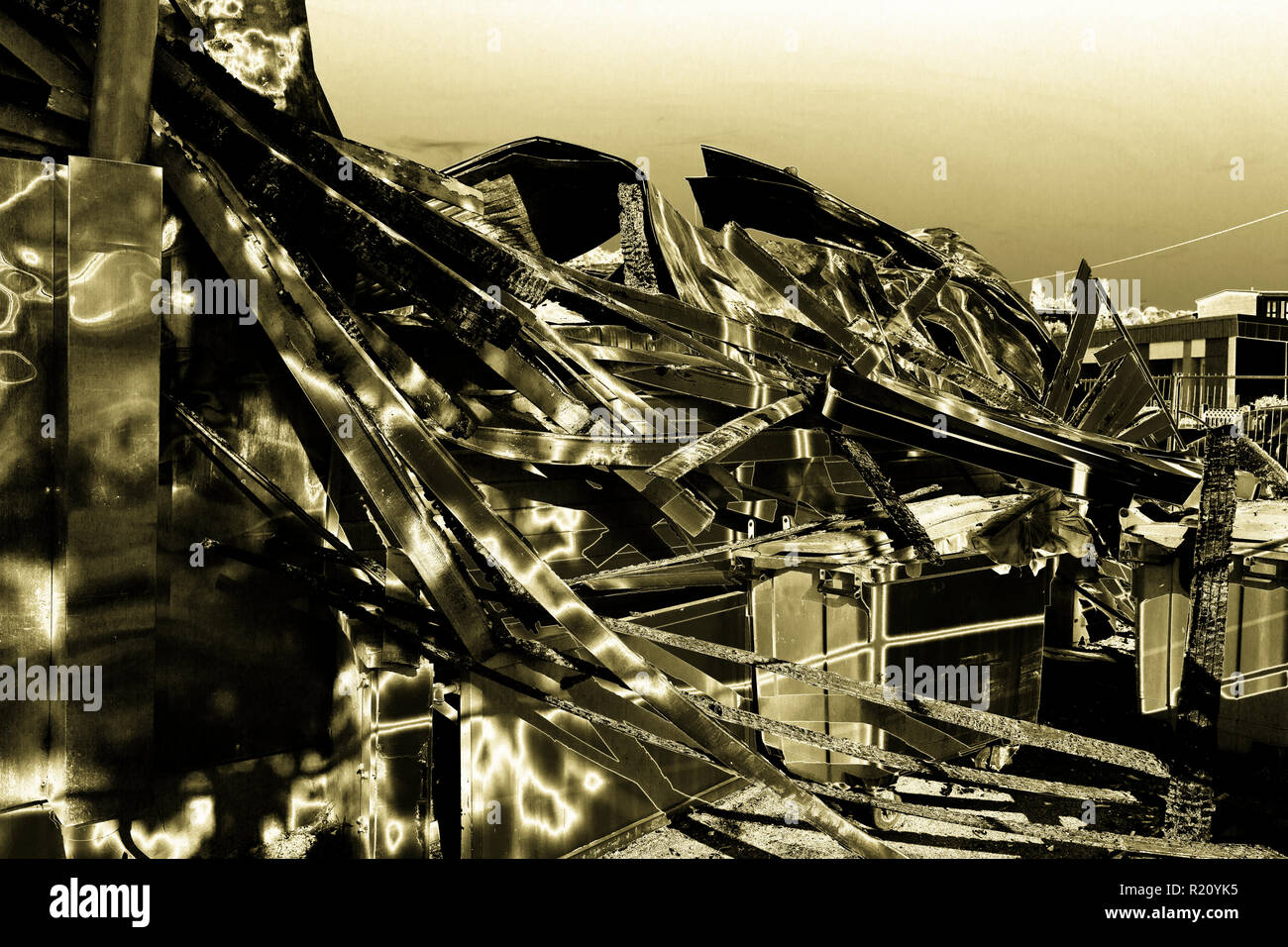 Damaged industry supermarket after arson fire with burn debris of ...