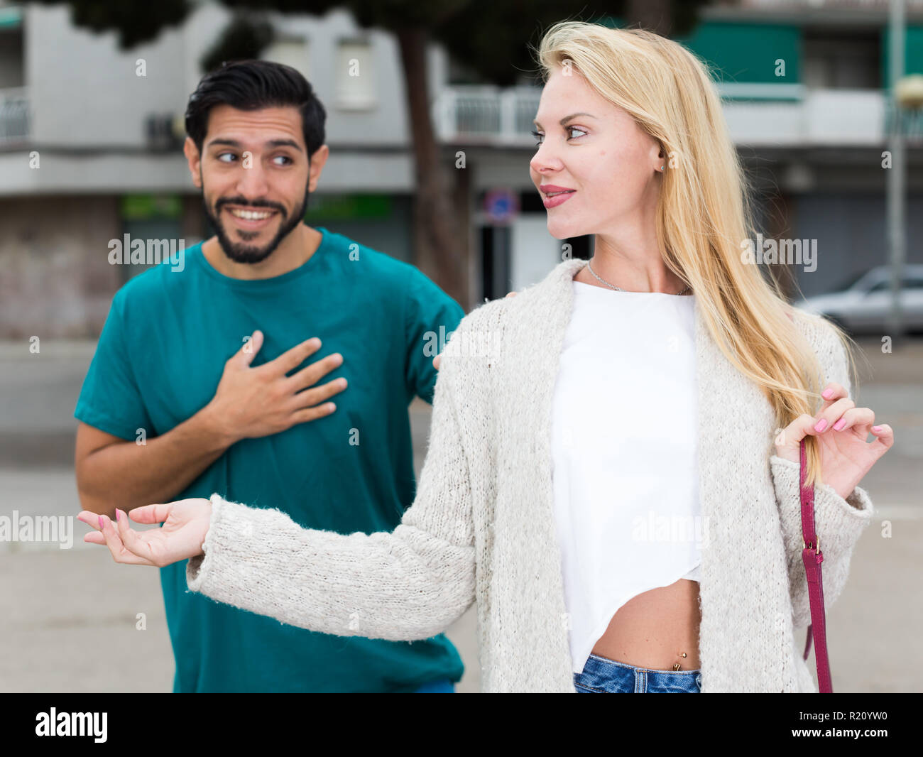 Latino couple talking street hi-res stock photography and images - Alamy