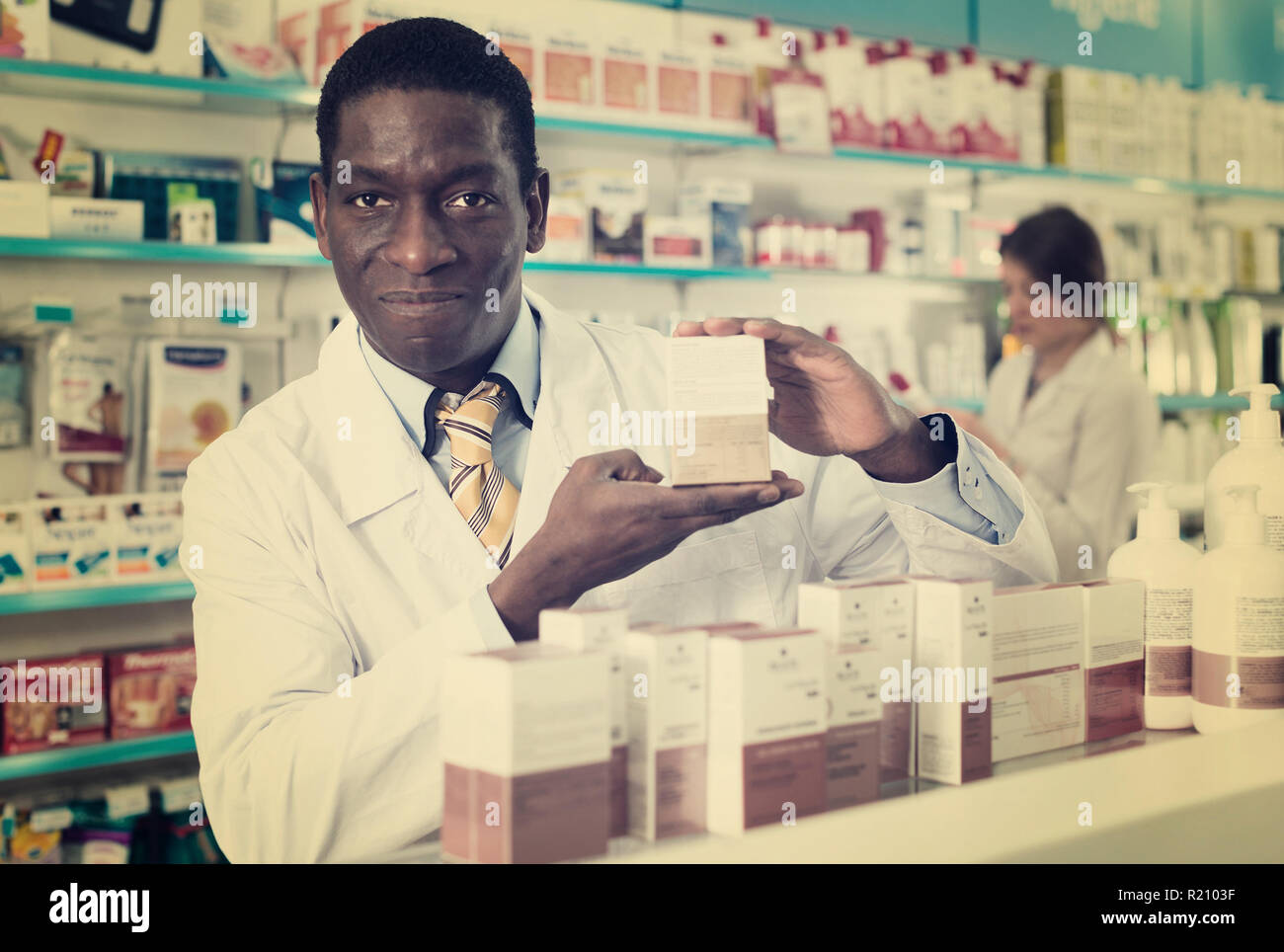Pharmacist prescription chemist handing hi-res stock photography and ...