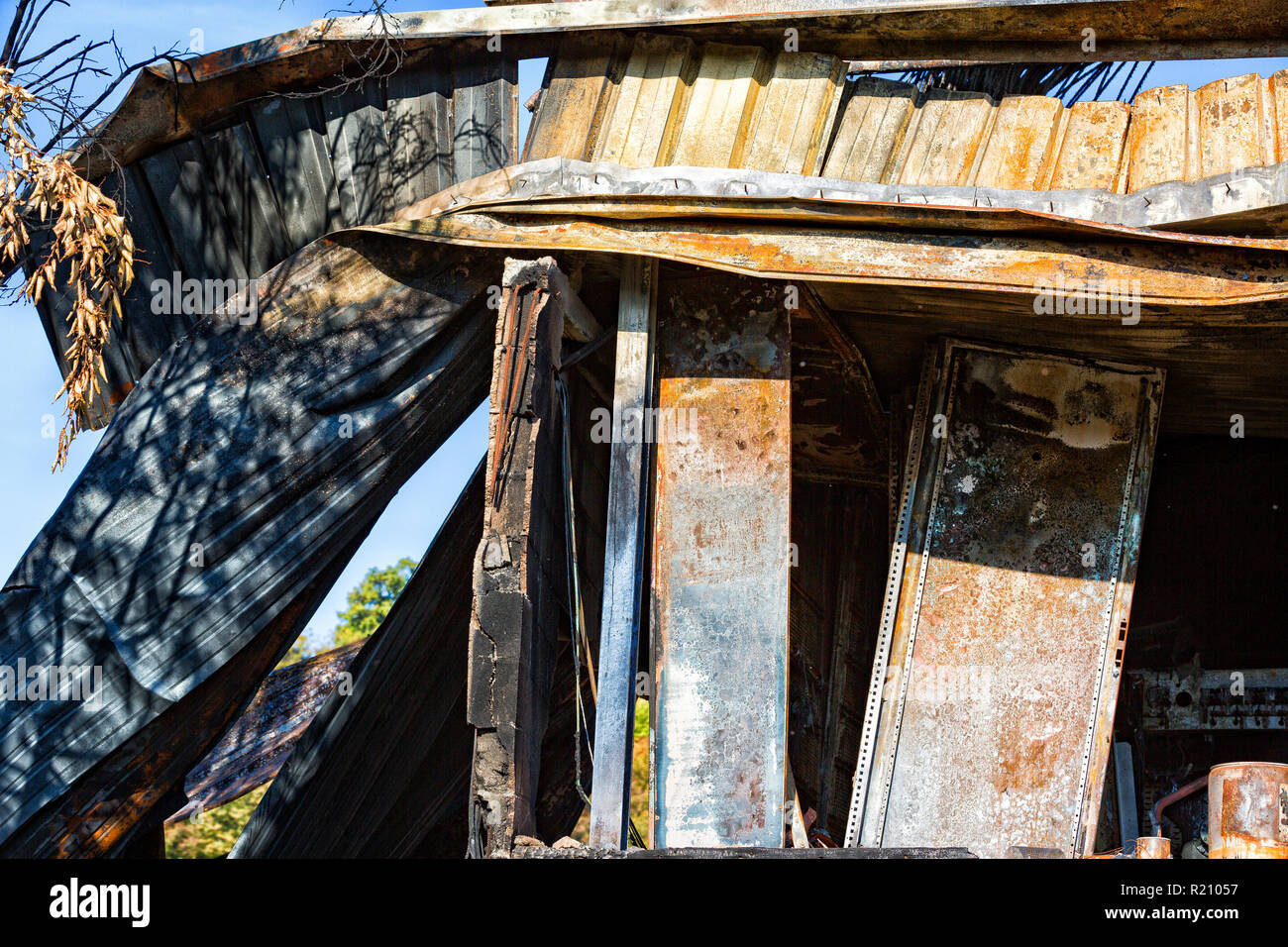 Damaged industry supermarket after arson fire with burn debris of ...