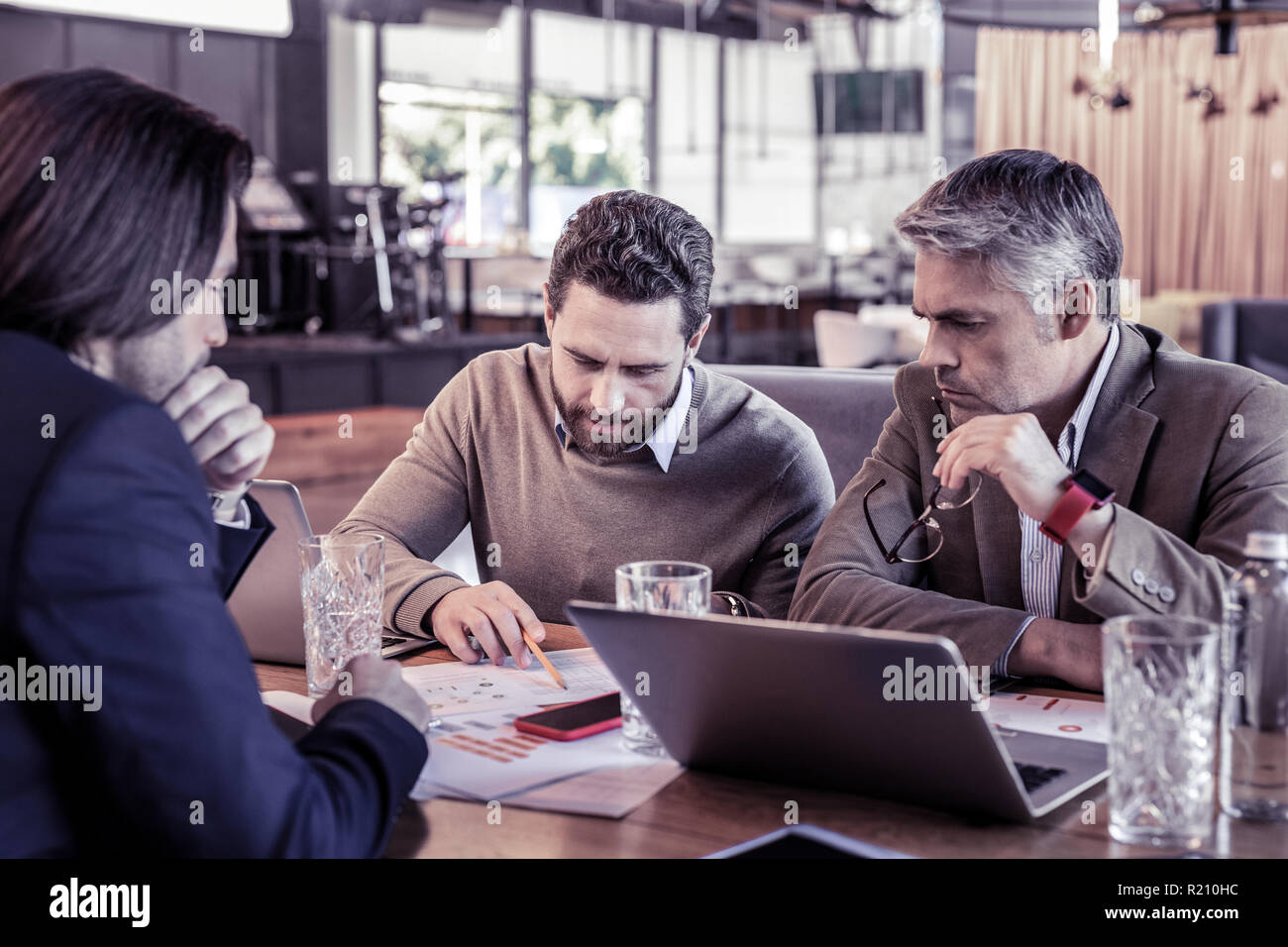 Business team examining plan hi-res stock photography and images - Alamy