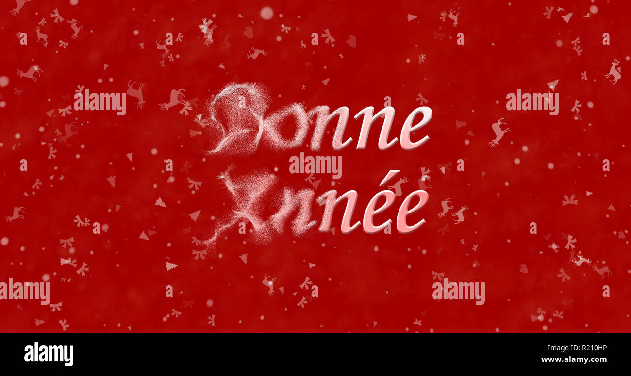 Happy New Year text in French "Bonne annee" turns to dust from left on ...