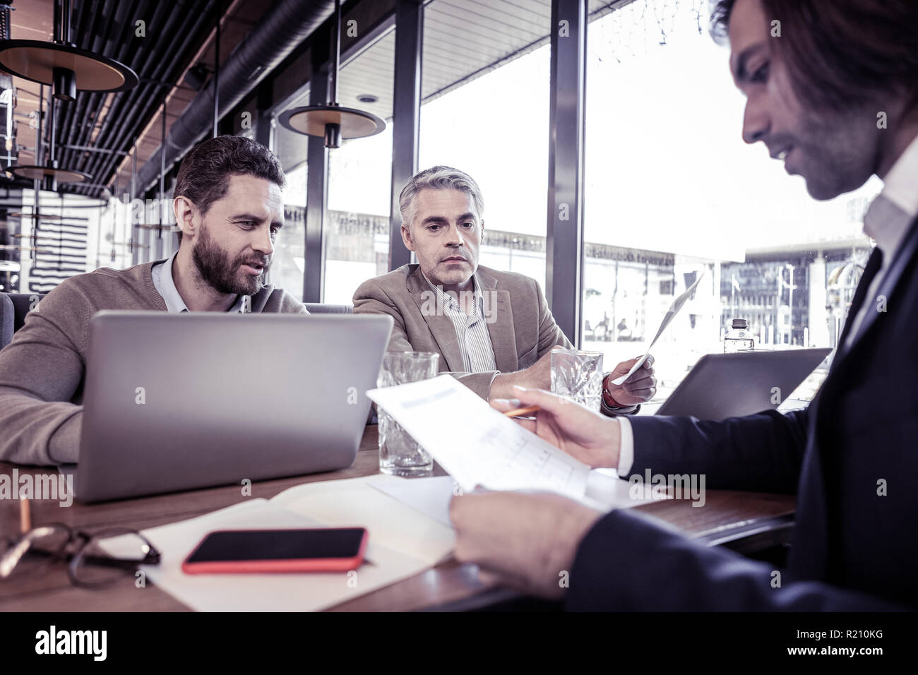 Team manager checking coworkers project hi-res stock photography and ...