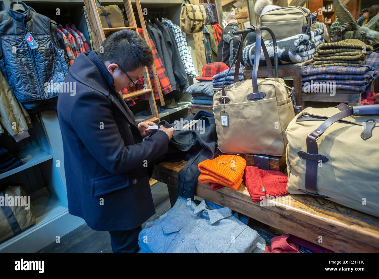 Shoppers invade the new Filson store on Union Square in New York during ...