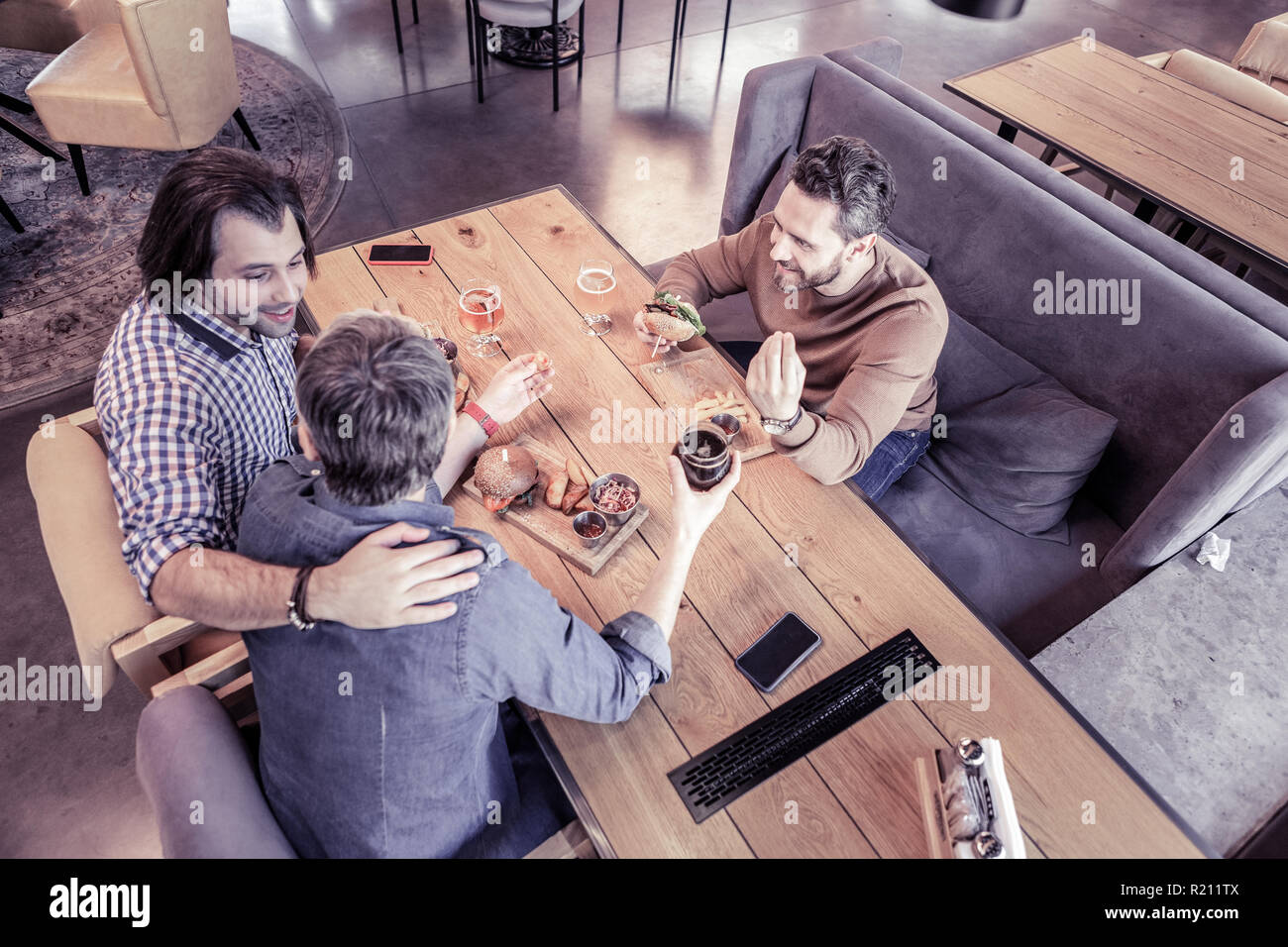 Group of happy males that spending weekend together Stock Photo - Alamy