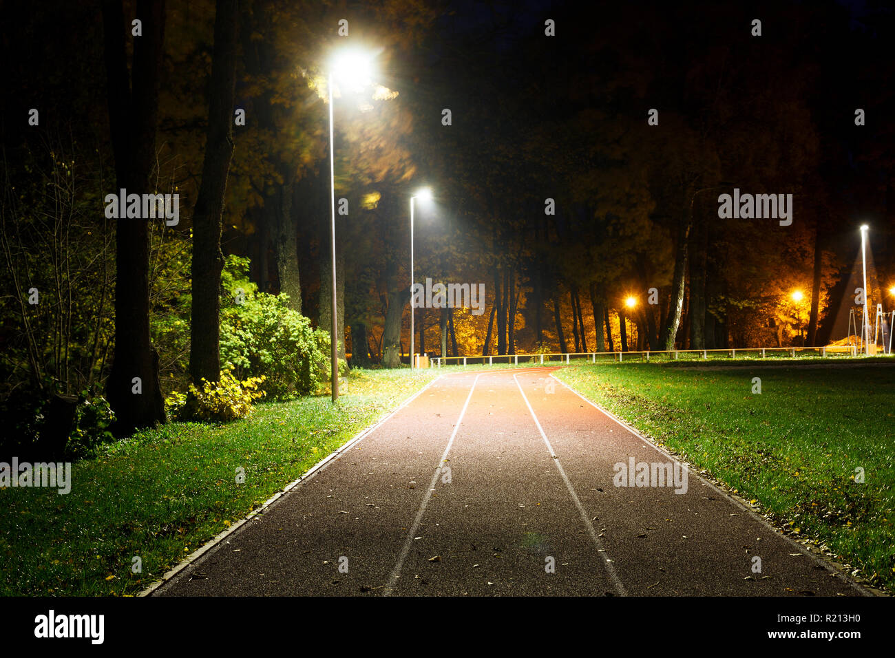 empty running track in small countryside stadium Stock Photo - Alamy