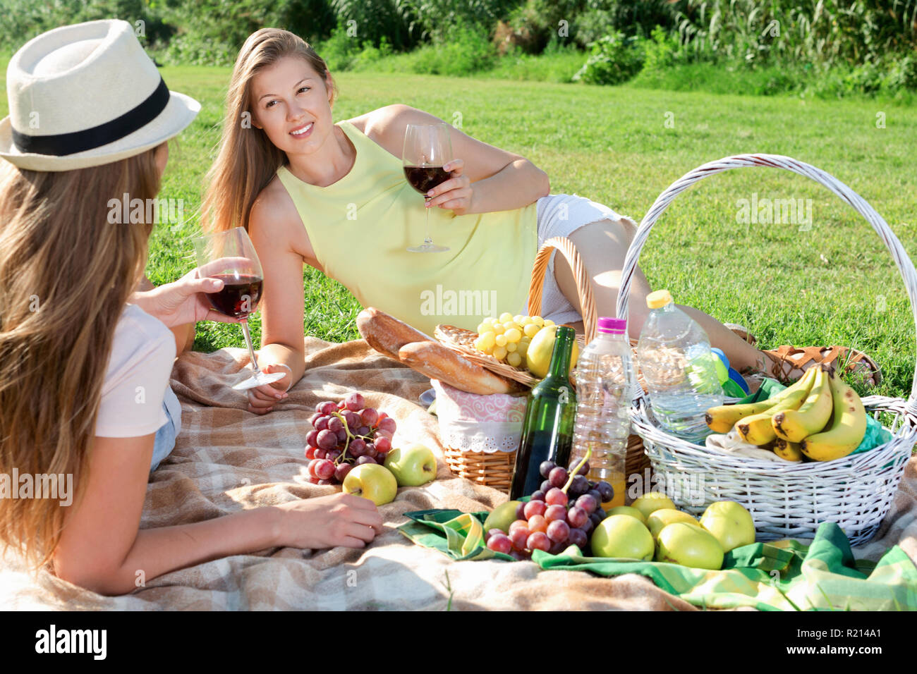 Happy cheerful smiling girl enjoying conversation with her friend on ...