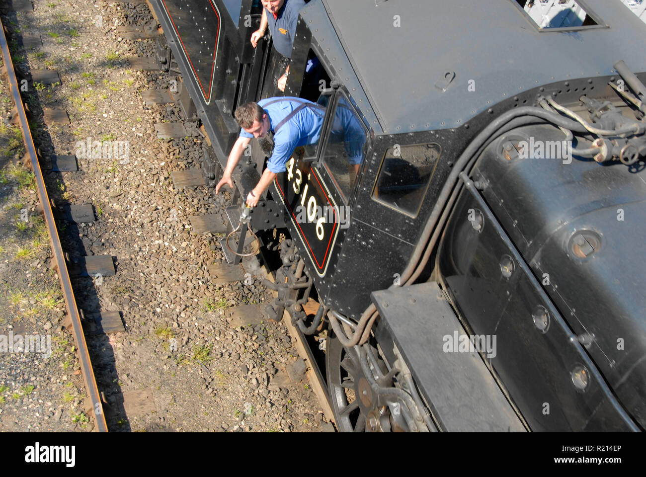 Train driver preparing to exchange tokens before entering section of ...