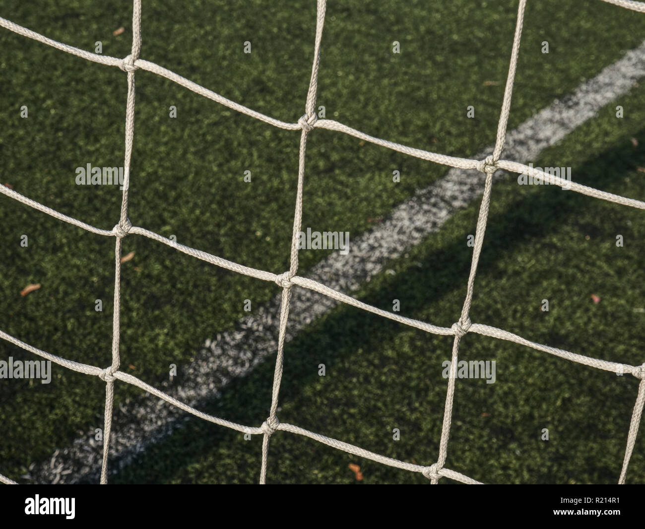 Frame of football gate, white gate net on background of a green ...