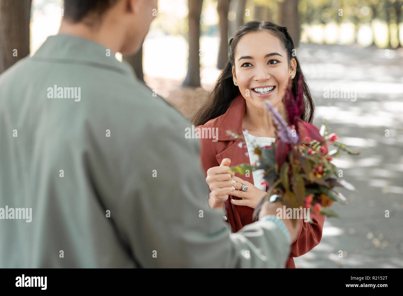Positive delighted female person looking at her partner Stock Photo - Alamy