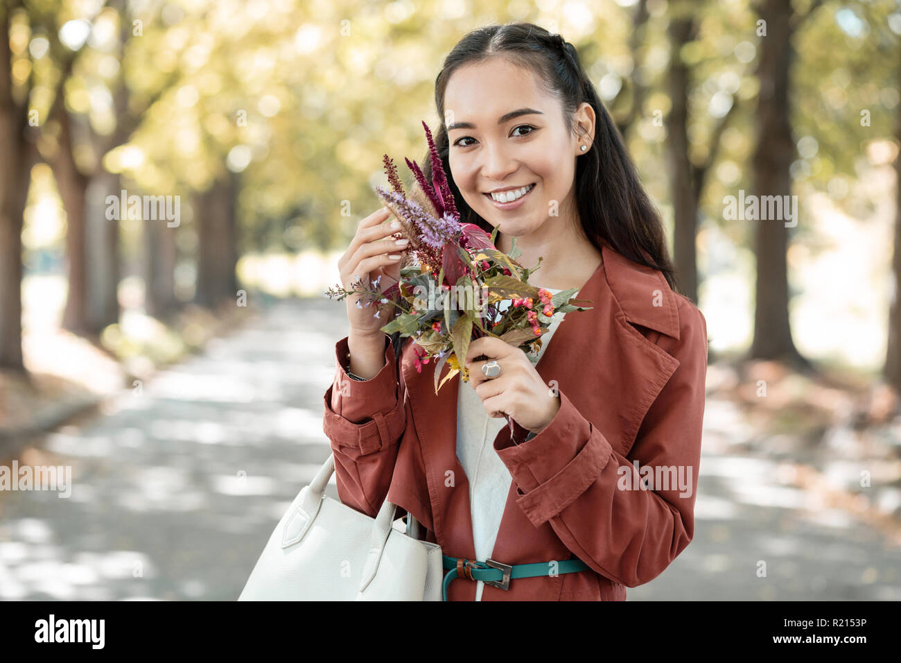 Beautiful female person standing on the foreground Stock Photo - Alamy